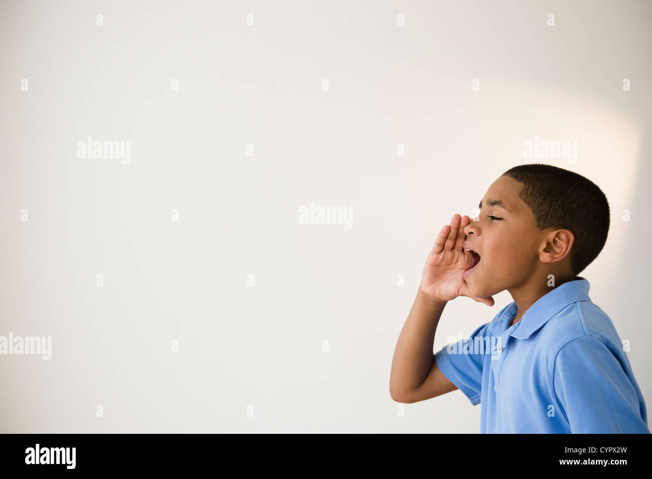 Hispanic boy shouting Stock Photo - Alamy