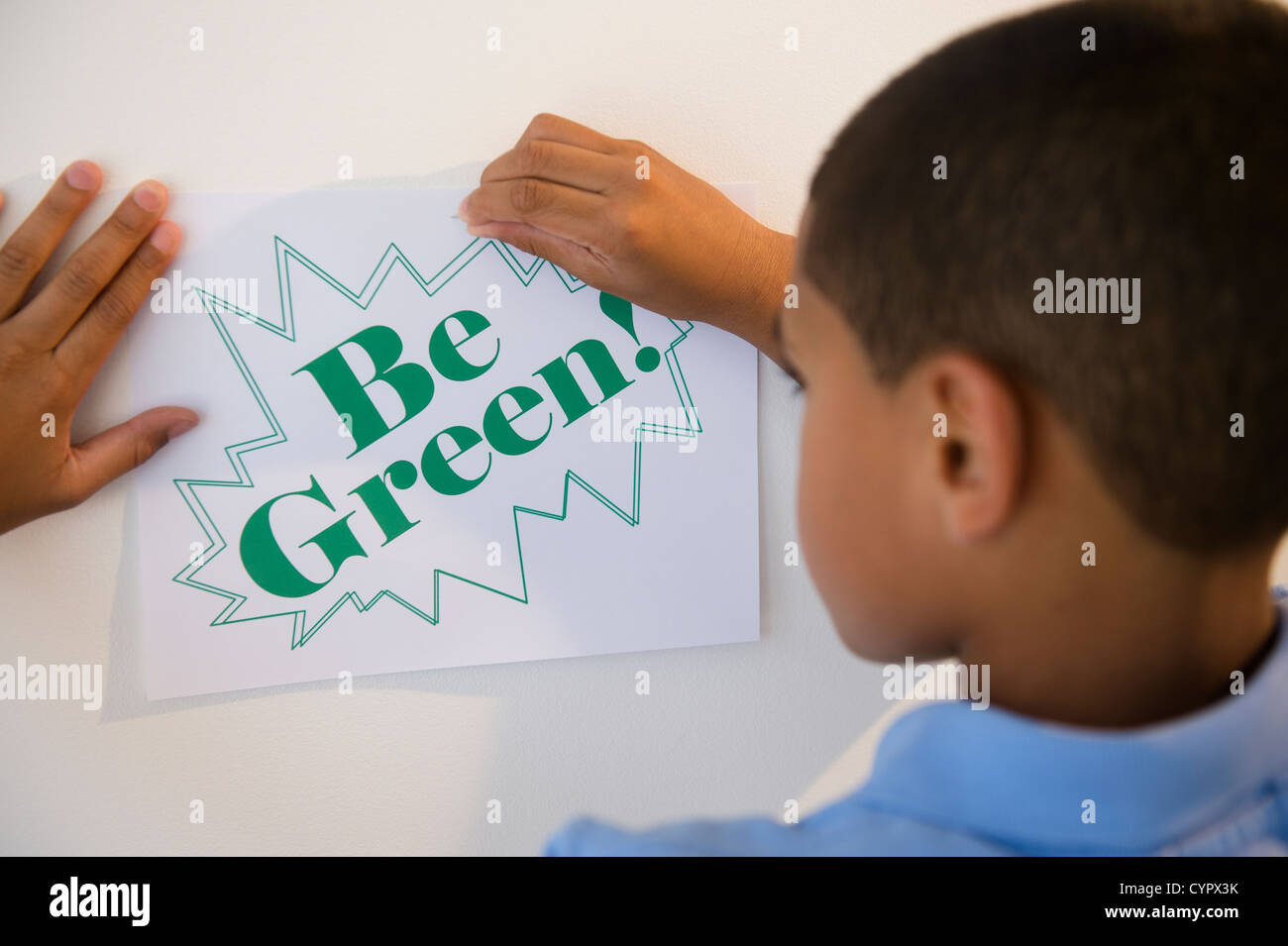 Putting poster up hi-res stock photography and images - Alamy