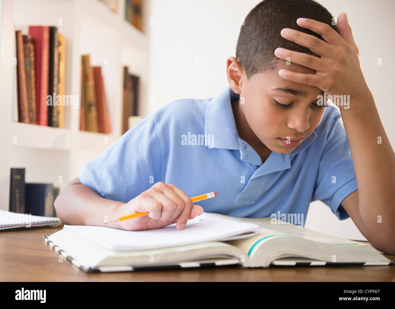 Hispanic boy doing homework Stock Photo - Alamy