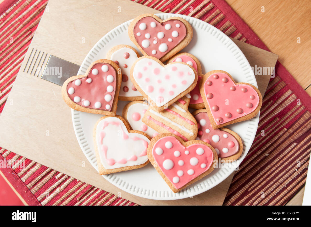 Pink heart shaped cookies beautifully decorated Stock Photo - Alamy