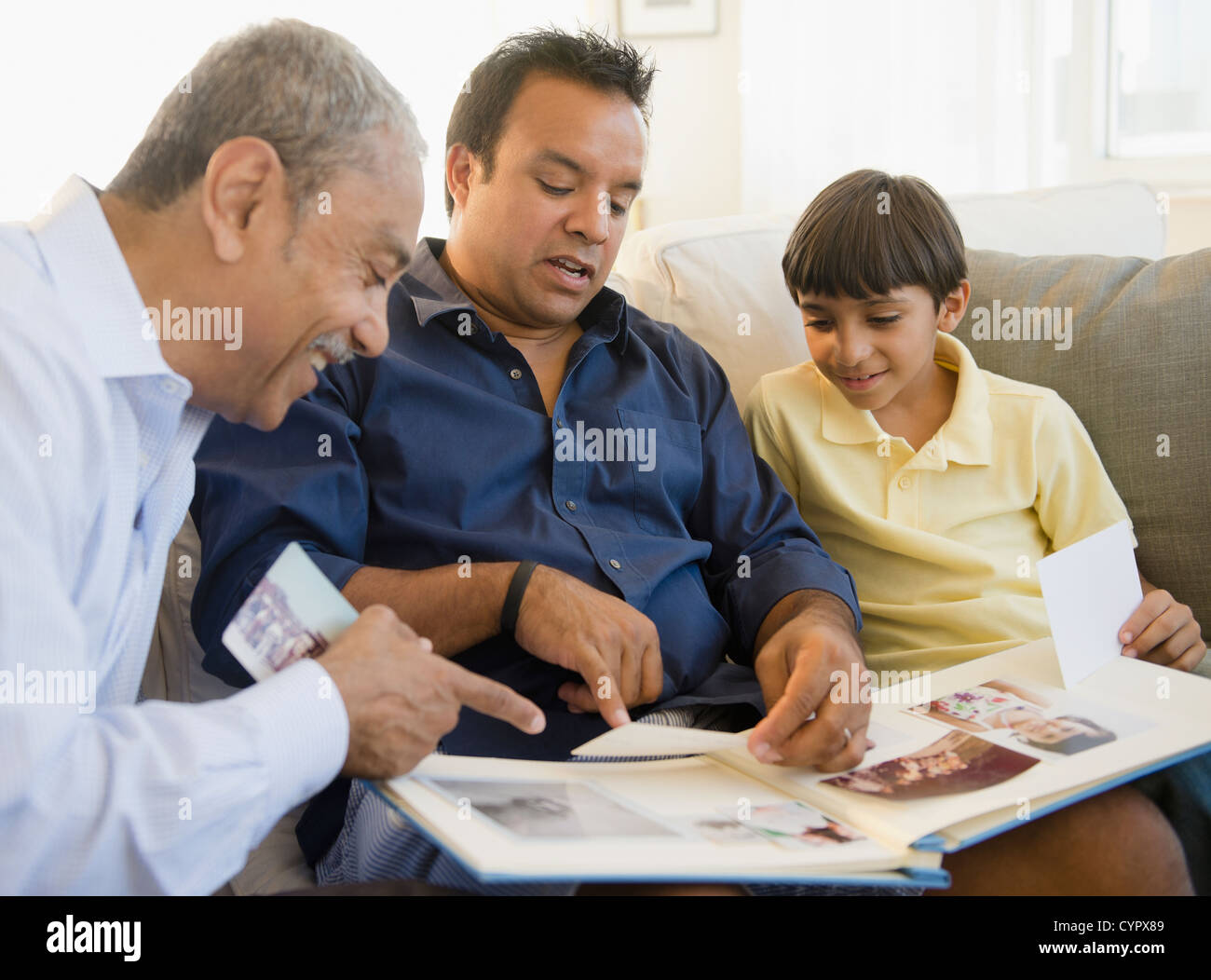 Father son looking photo album hi-res stock photography and images - Alamy