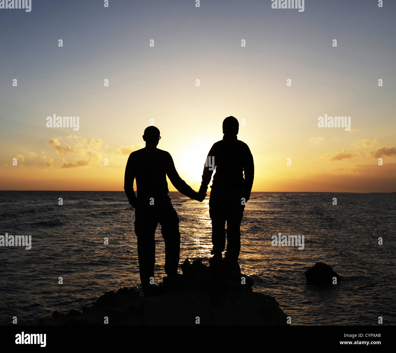 Couple on sunset Stock Photo - Alamy