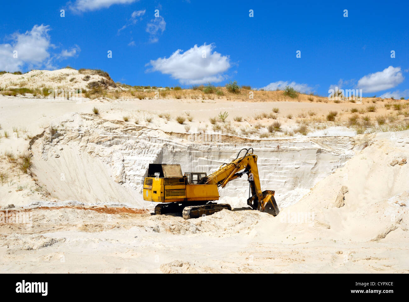Old yellow dredge in sandy to career Stock Photo - Alamy
