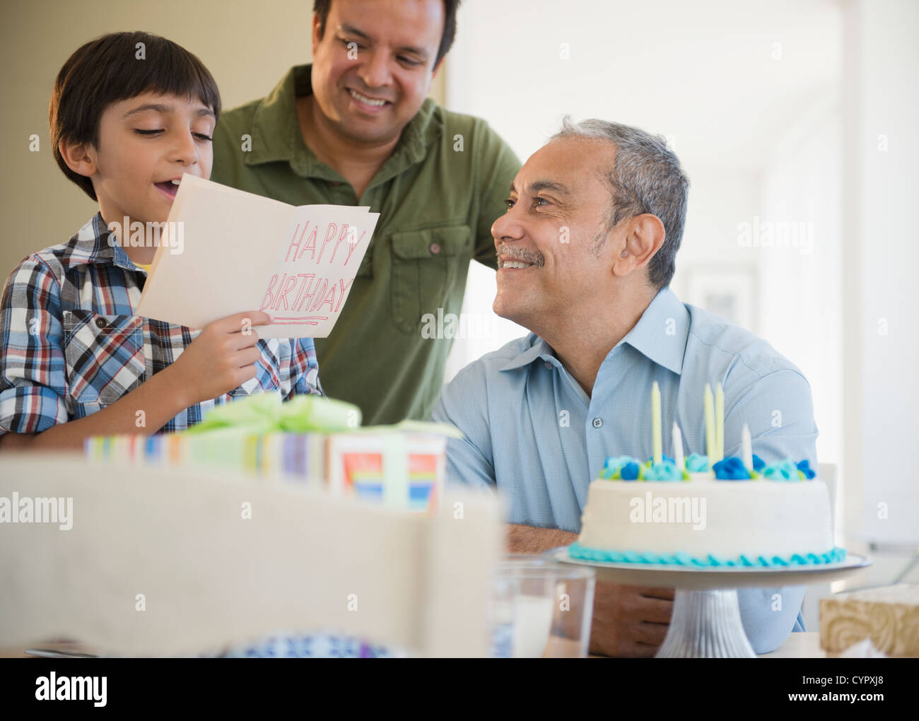 Hispanic grandfather, father and son celebrating birthday Stock Photo ...
