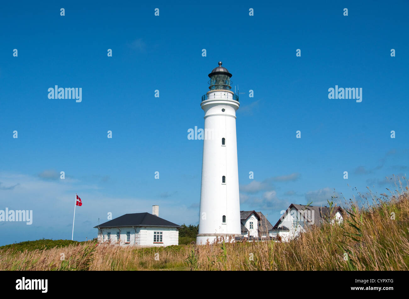 A danish lighthouse surrounded by fields and houses Stock Photo - Alamy