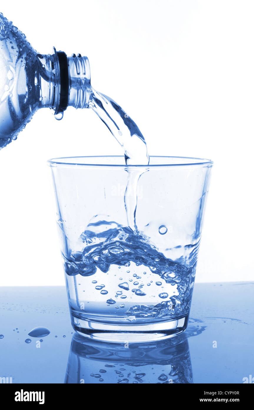 splashing water pouring in a glass with bubbles Stock Photo - Alamy
