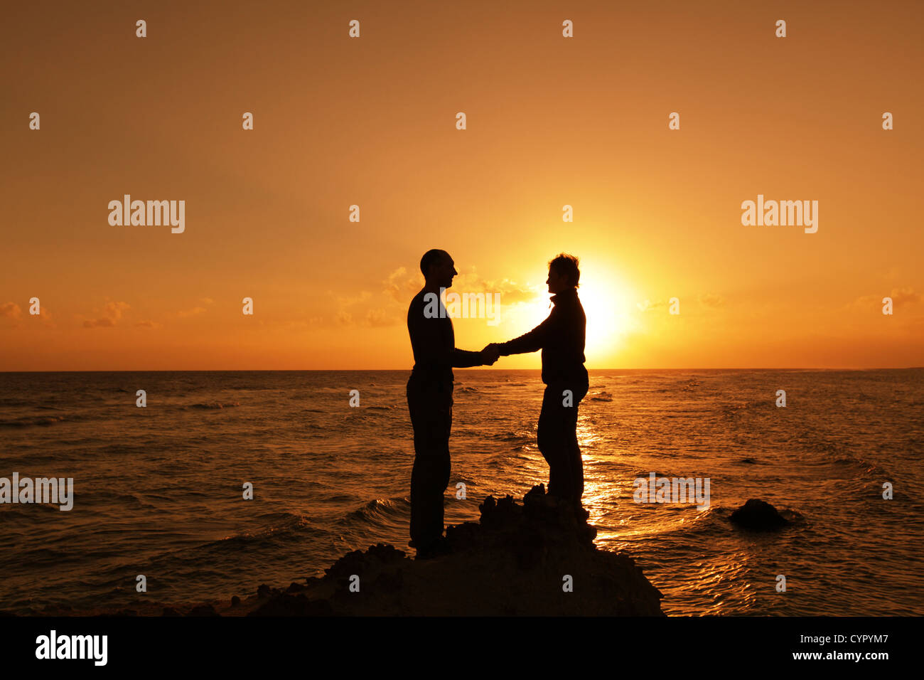 Couple on sunset Stock Photo - Alamy