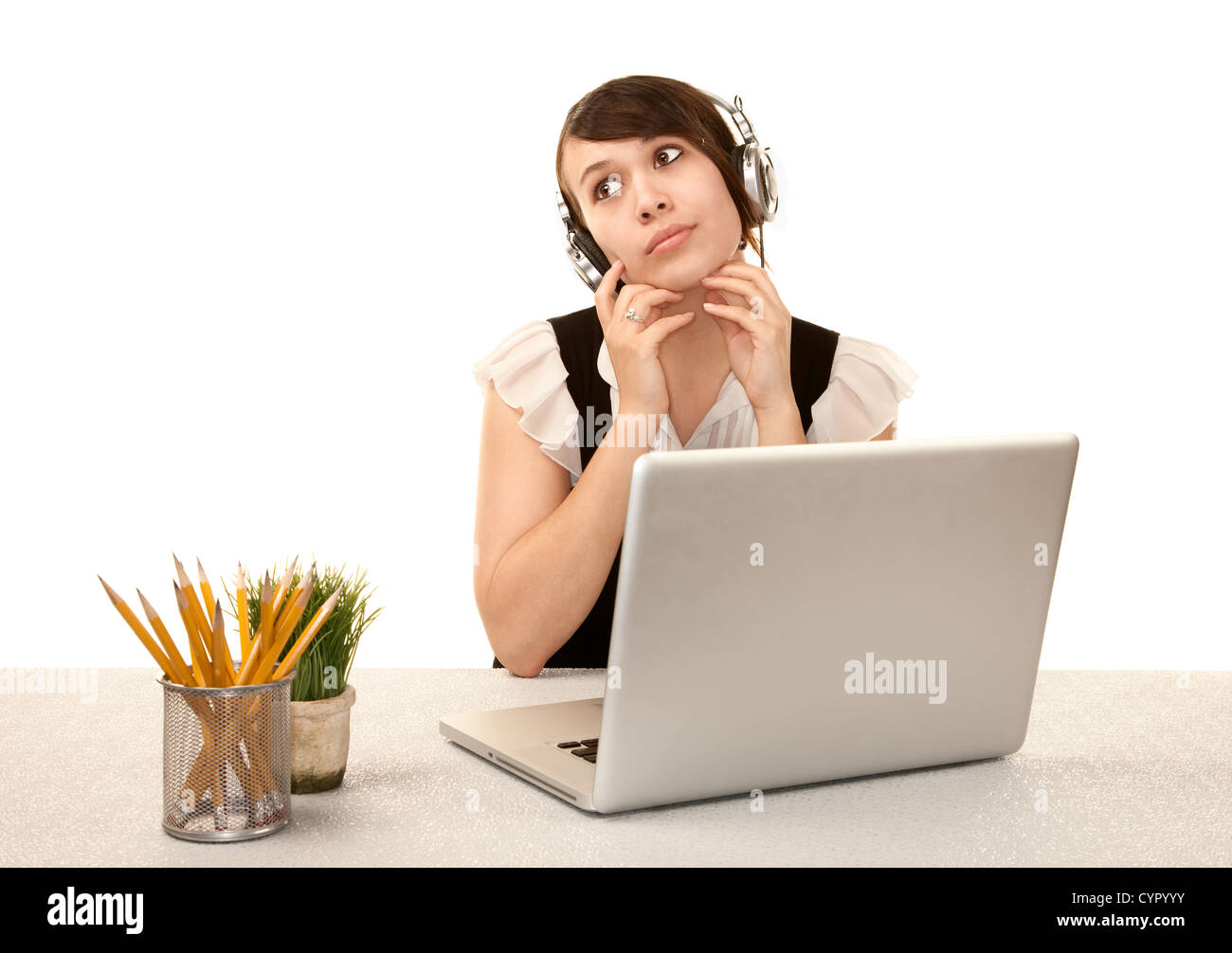 Pretty female office worker with laptop computer and headphones Stock ...