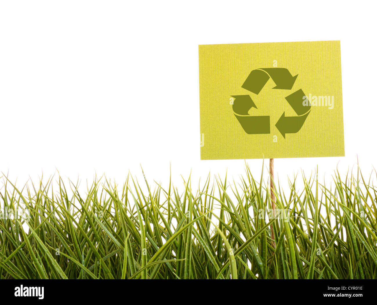 Green sign with recycle symbol in the grass with white background Stock ...