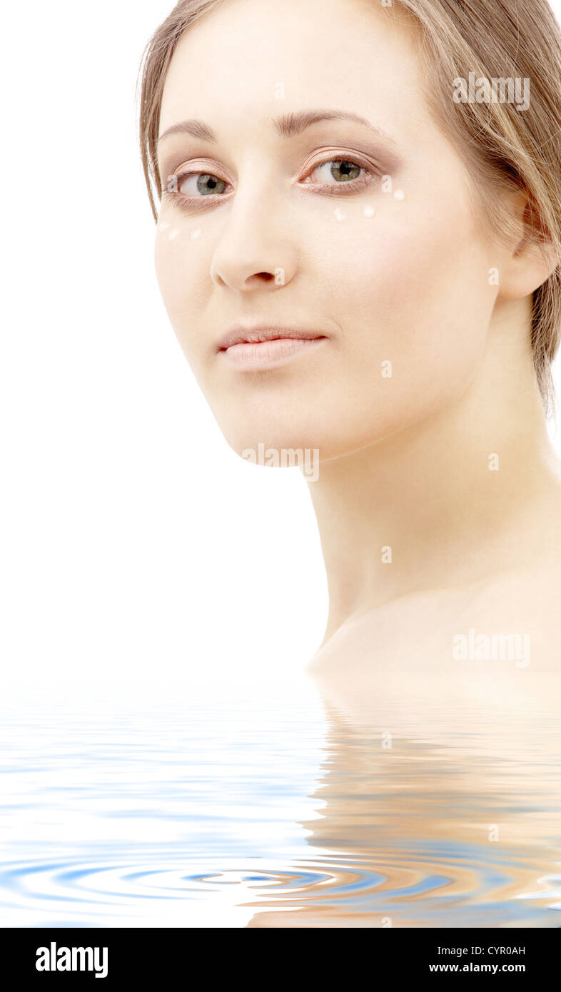 beautiful woman with moisturizing milk drops on face in water Stock ...