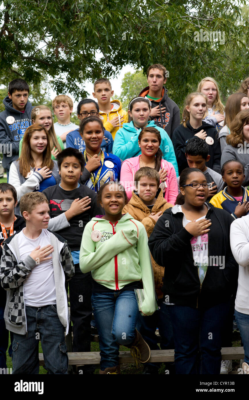 Multicultural group of Texas junior high school students recite Pledge ...