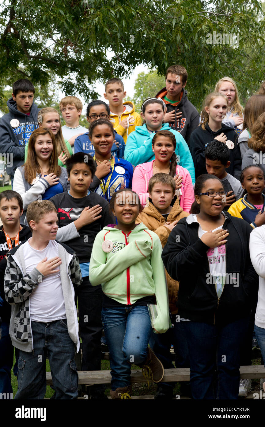 Multicultural group of Texas junior high school students recite Pledge ...