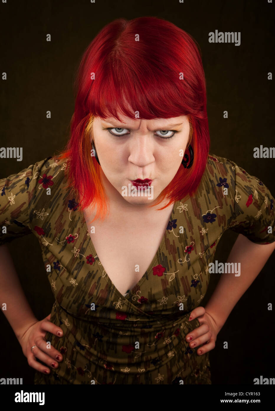 Pretty punky girl with brightly dyed red hair Stock Photo - Alamy