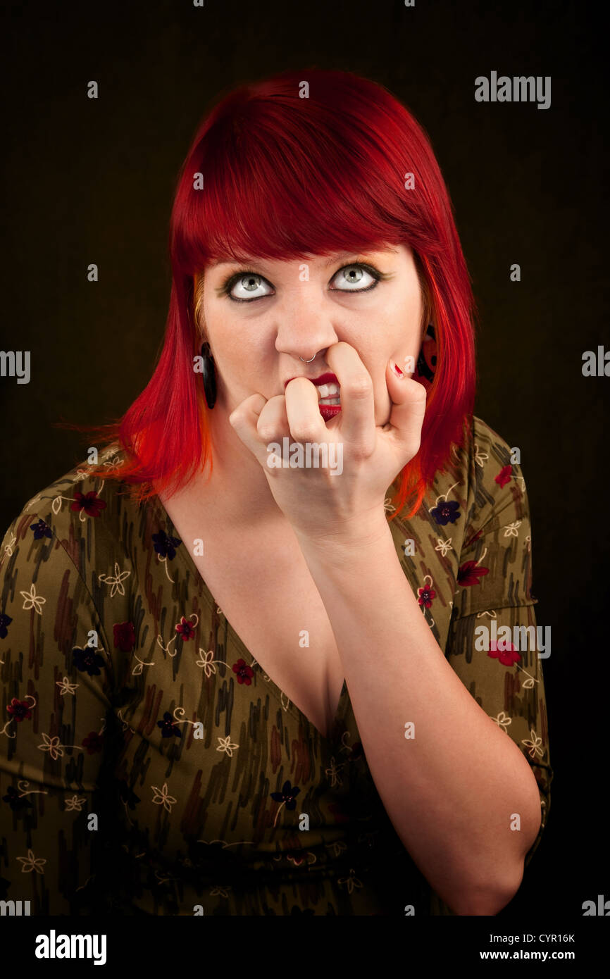 Pretty punky girl with brightly dyed red hair Stock Photo - Alamy