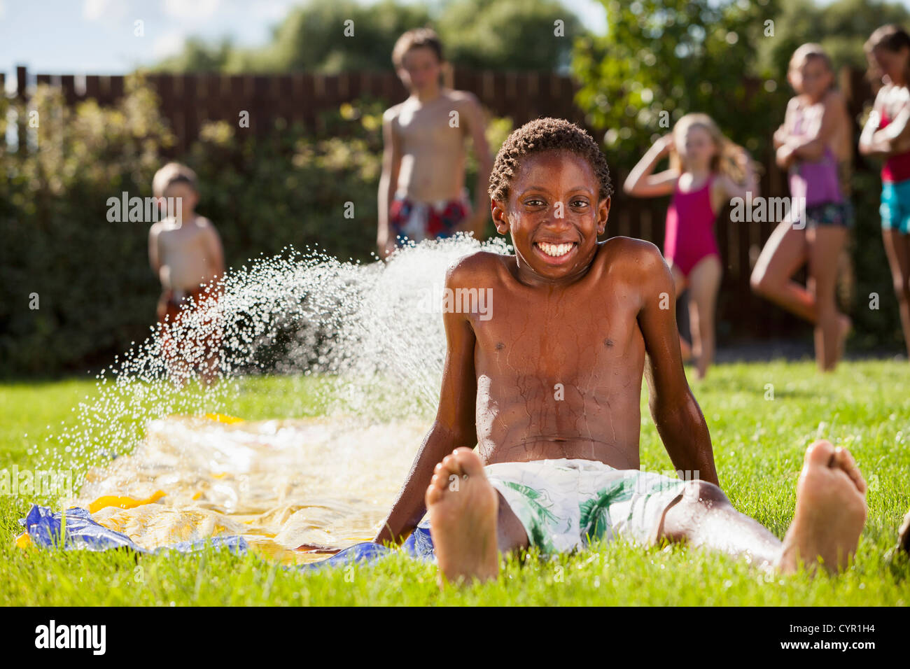 Black boys in water hi-res stock photography and images - Alamy