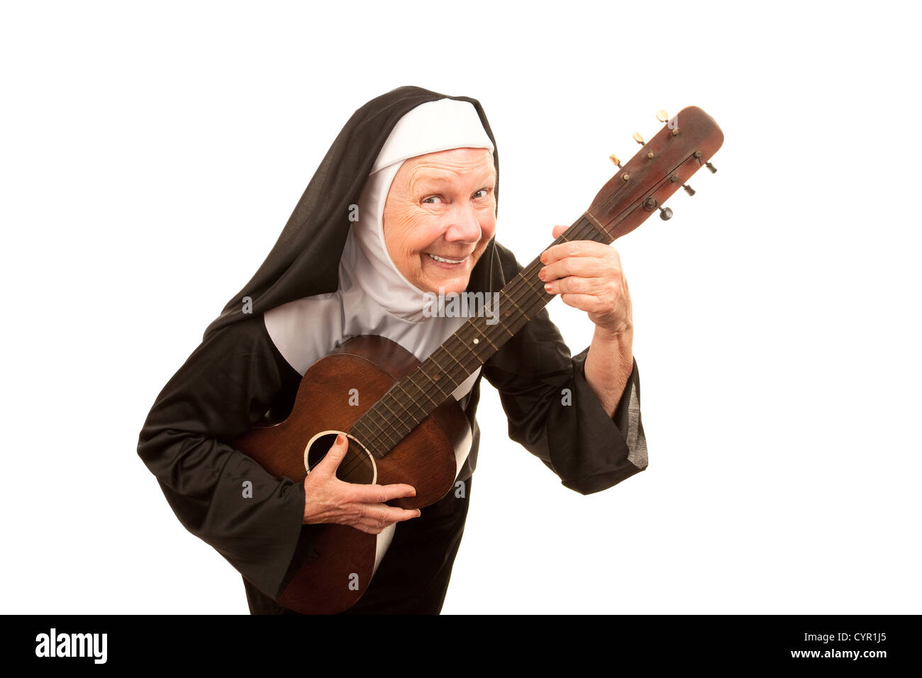 Funny singing nun with old guitar and religious habit Stock Photo - Alamy