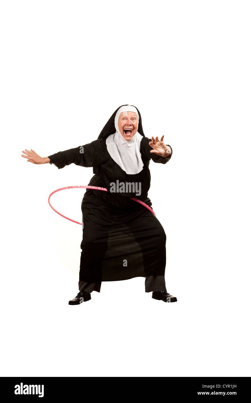 Playful nun on white with plastic hoop Stock Photo - Alamy