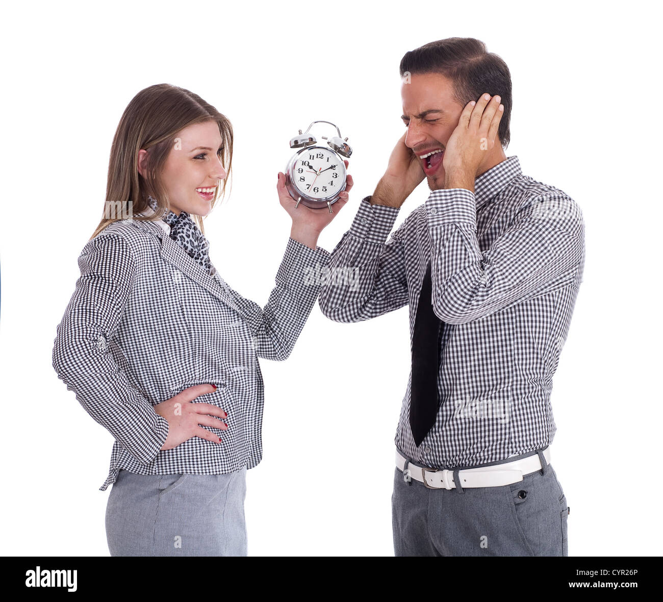 Young Business men and women having fun with alarm clock in the office ...