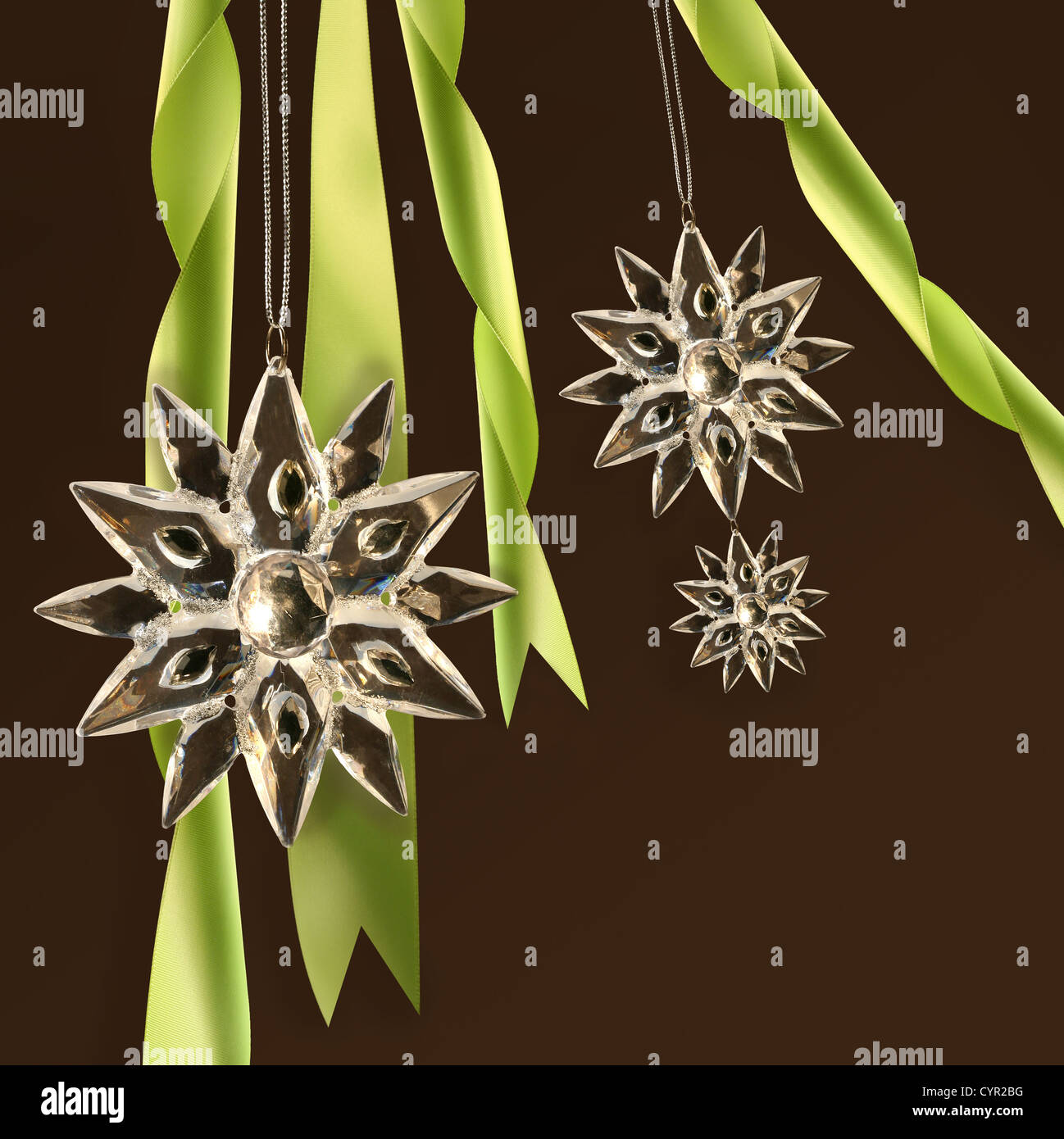 Crystal snowflakes with green ribbons on dark background Stock Photo ...