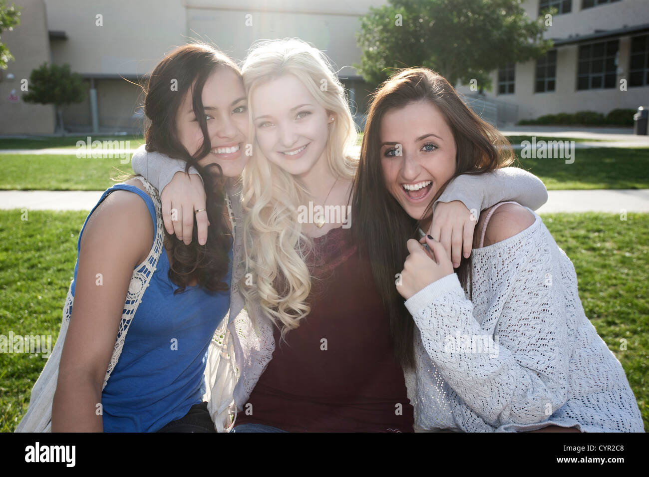 School friends hugging Stock Photo - Alamy