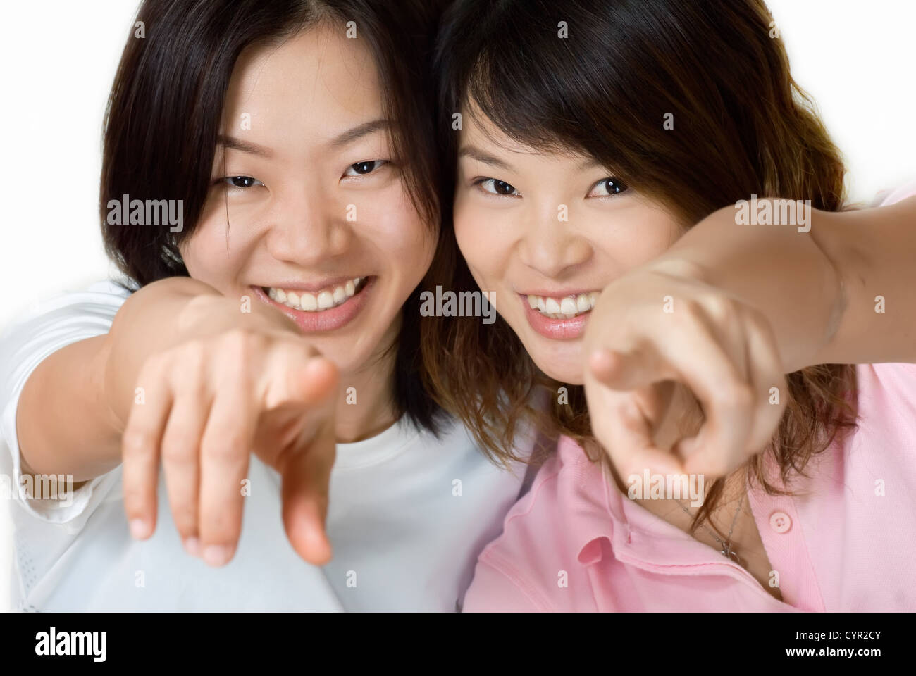 Happy smile friends of Asian women pointing Stock Photo - Alamy