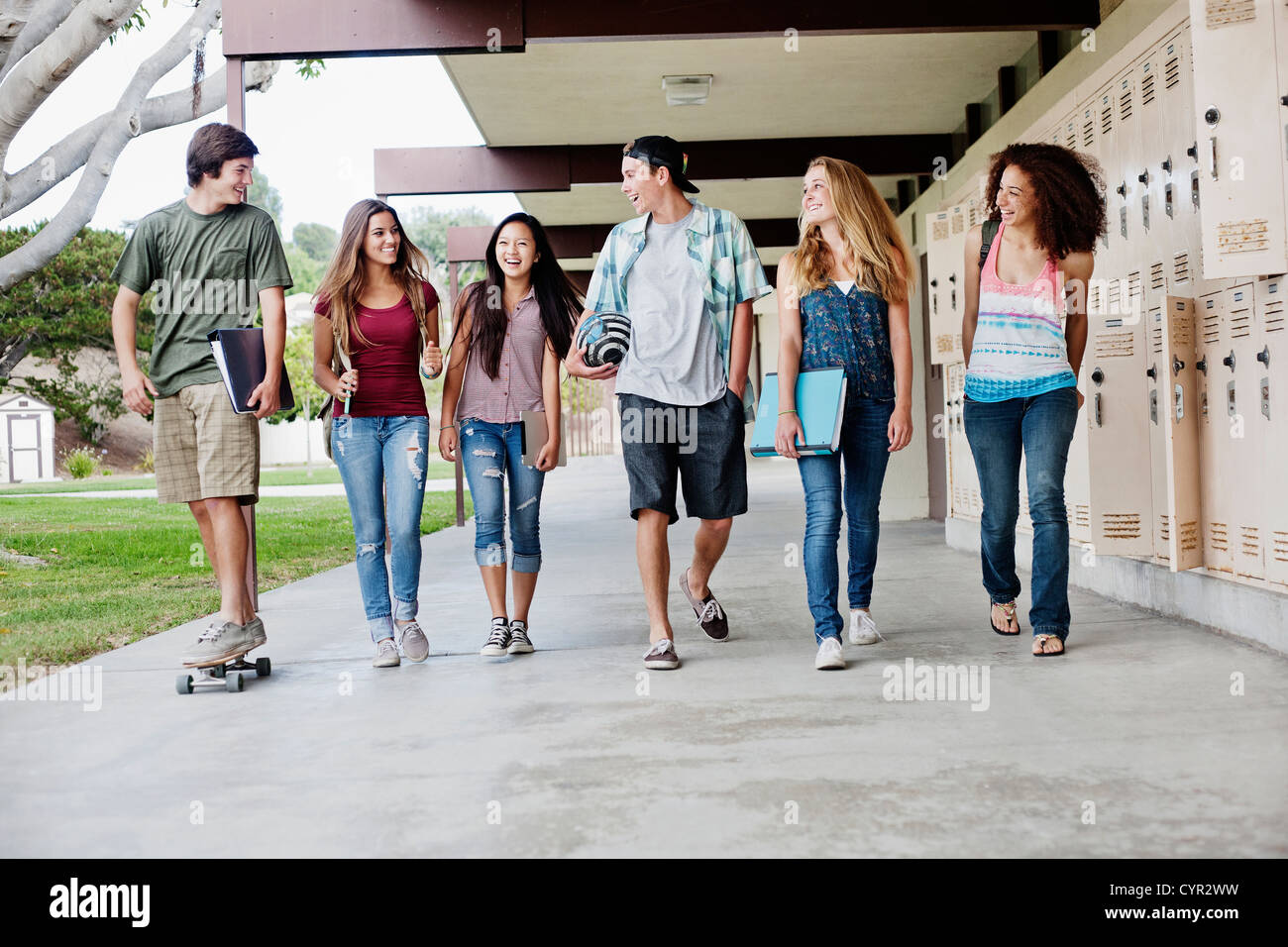 School friends walking in portico Stock Photo - Alamy