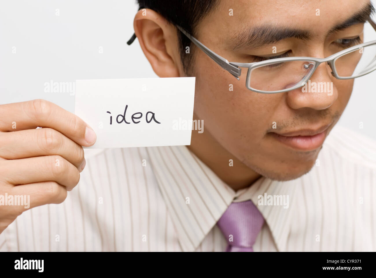 Idea concept holding by Asian business man Stock Photo - Alamy