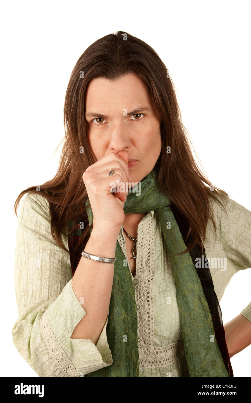 Pretty concerned woman in green on white background Stock Photo - Alamy