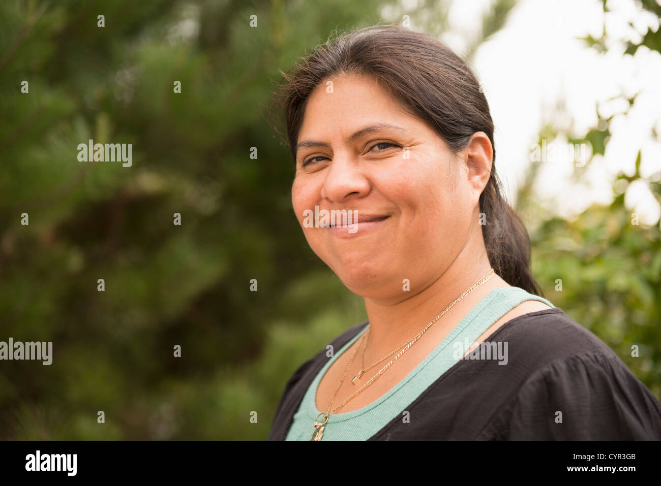 Smiling Hispanic woman Stock Photo - Alamy