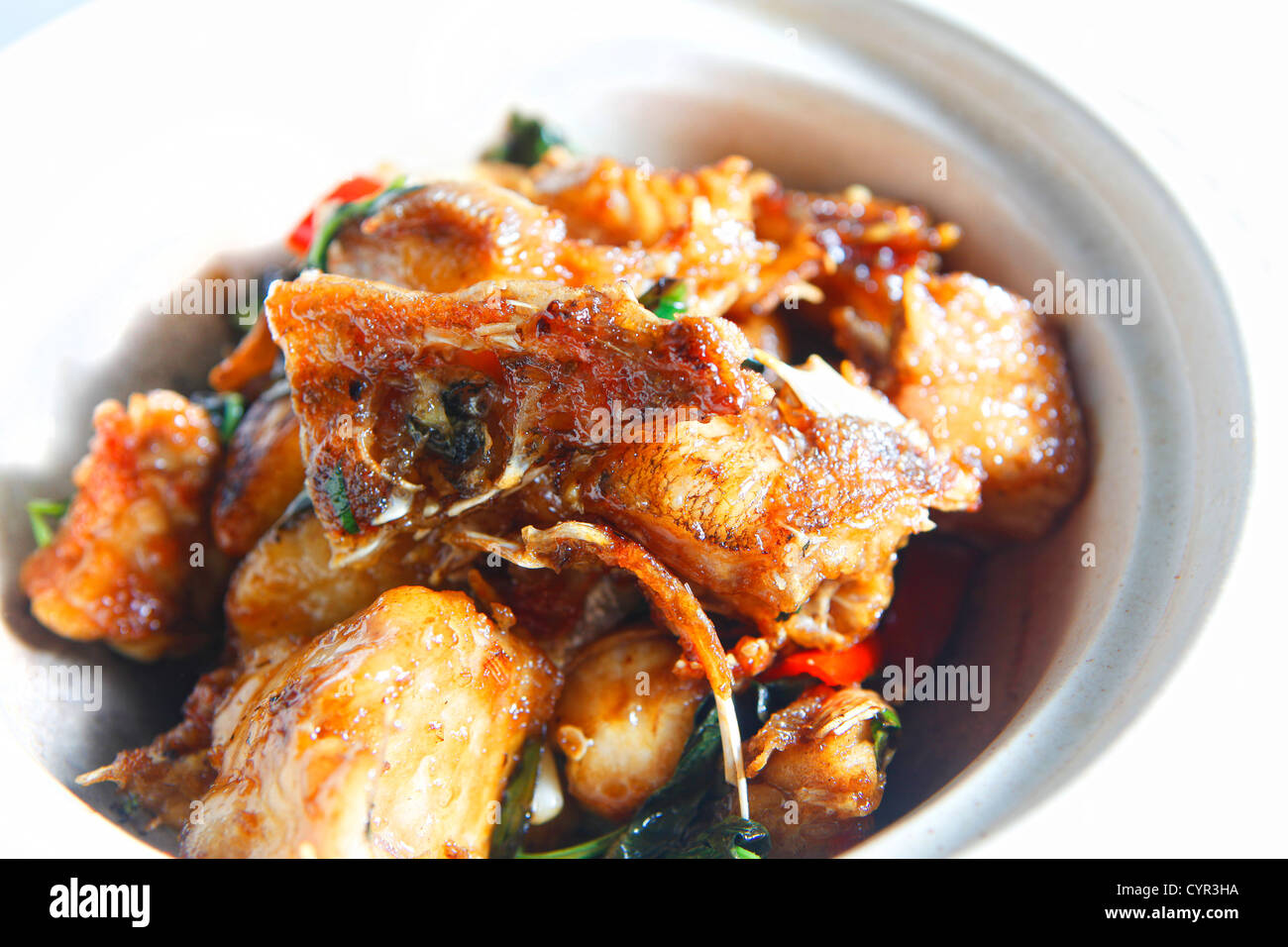 Fish with chili pepper in the bowl Stock Photo - Alamy