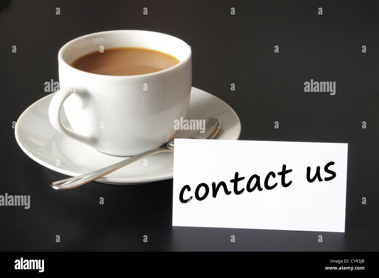 contact us and coffee cup showing business support concept Stock Photo ...