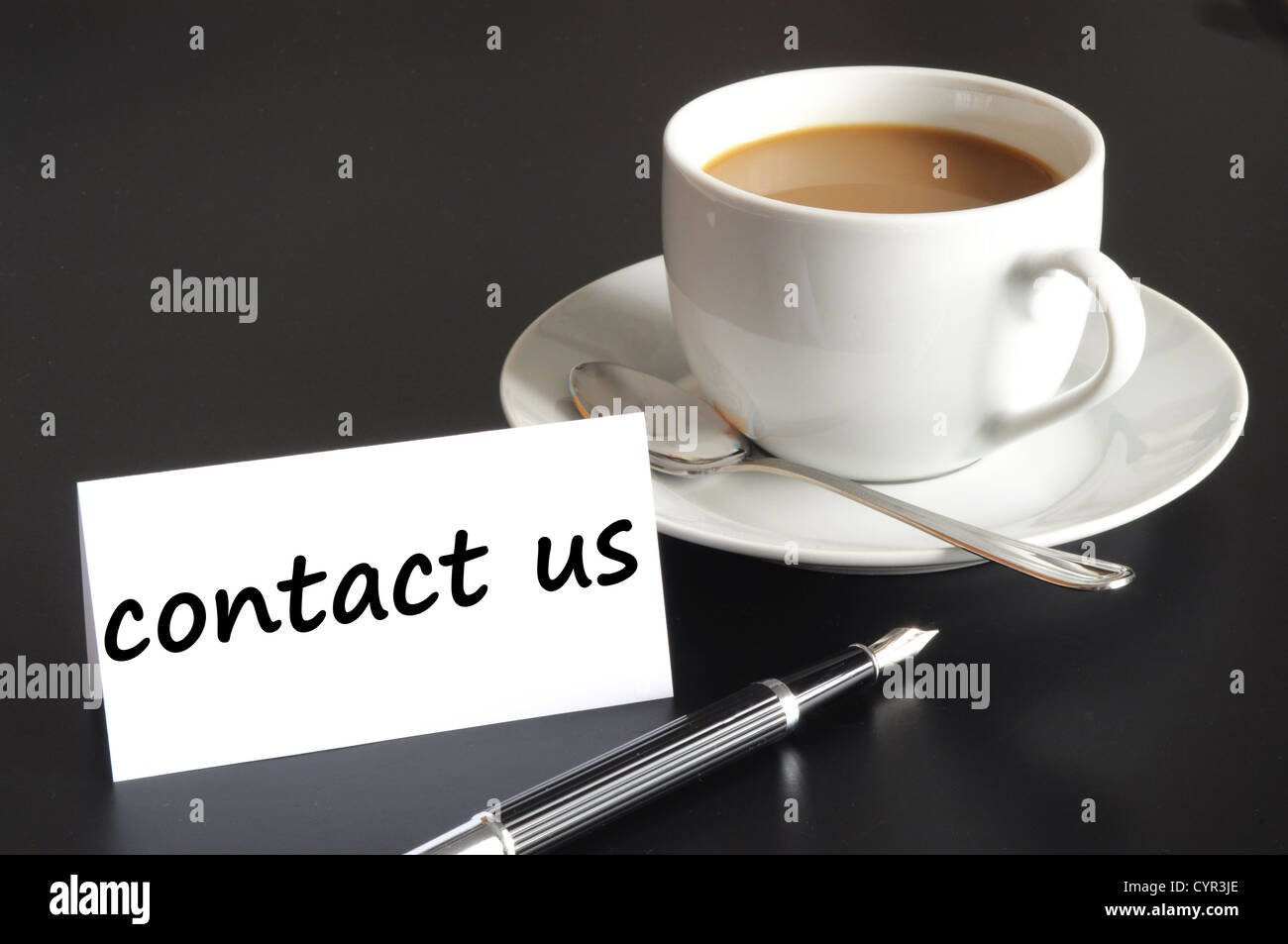 contact us and coffee cup showing business support concept Stock Photo ...