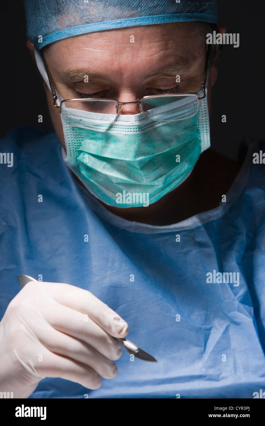 Caucasian surgeon performing surgery Stock Photo - Alamy