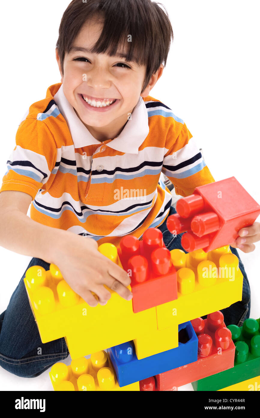 Cute little boy play on white isolated background Stock Photo - Alamy
