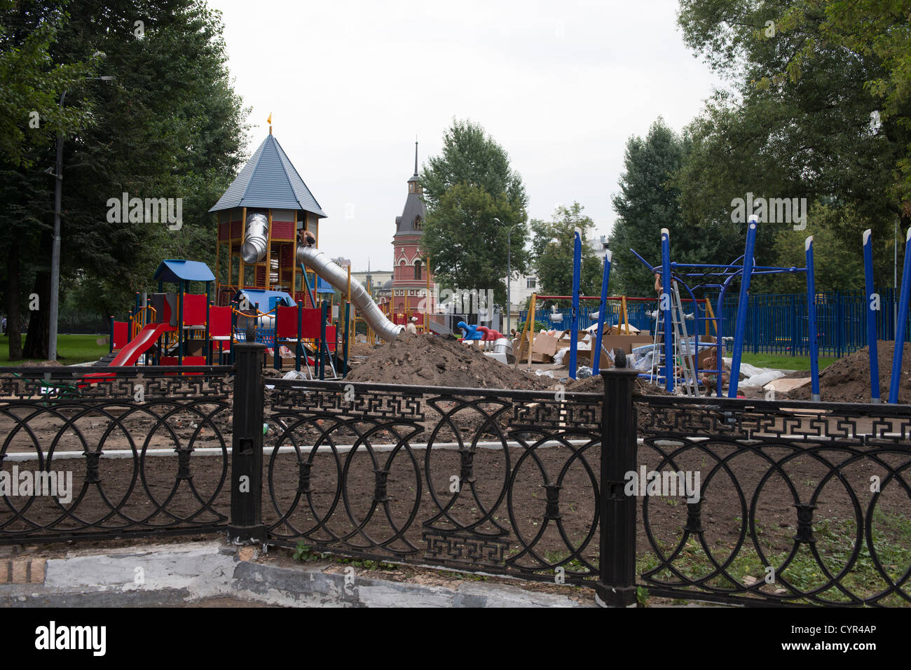 Moscow park playground working builder children Stock Photo - Alamy