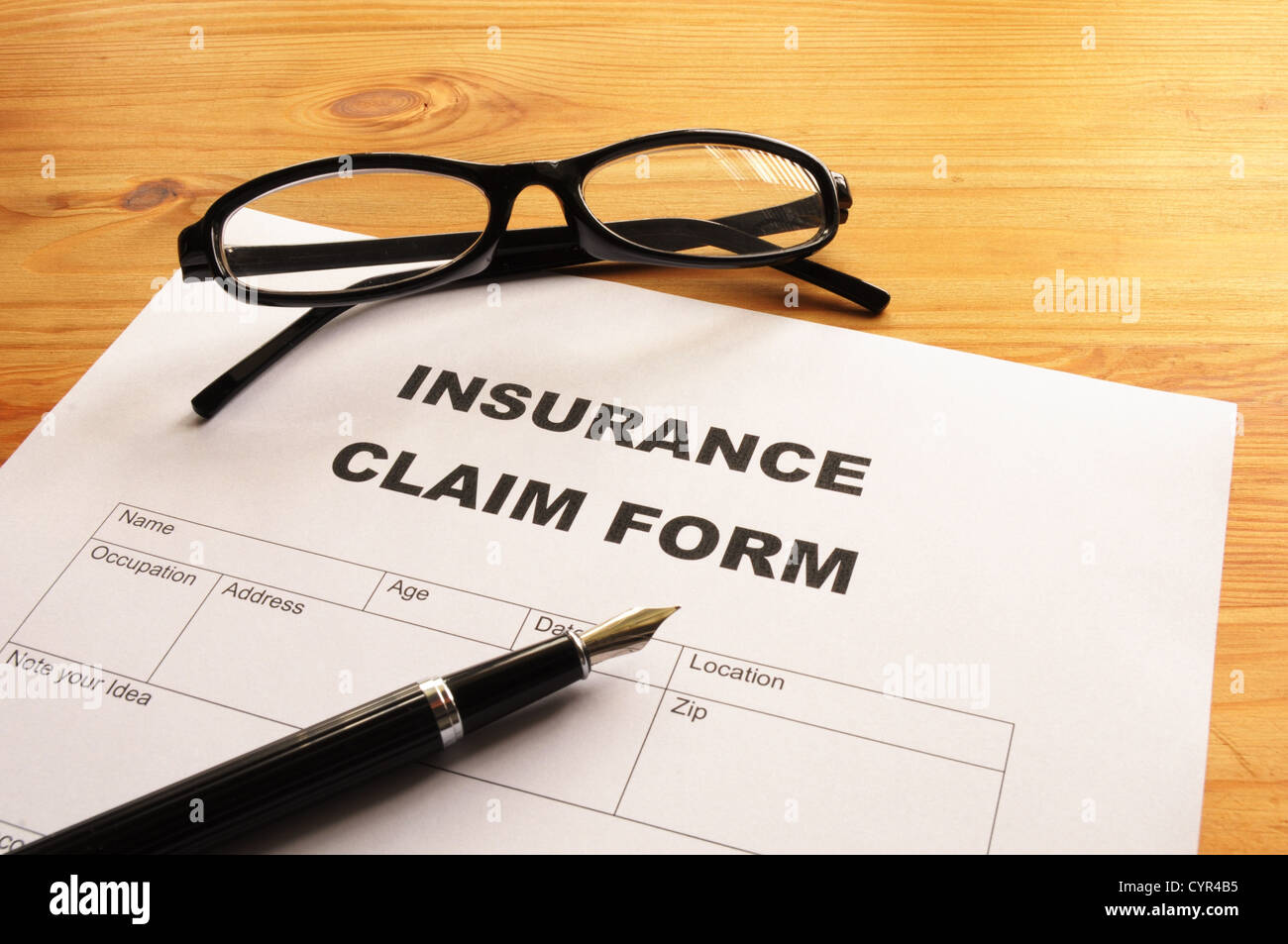 insurance claim for on desk in office showing risk concept Stock Photo ...