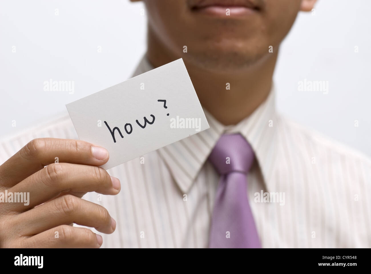 How card holding by businessman on white background Stock Photo - Alamy