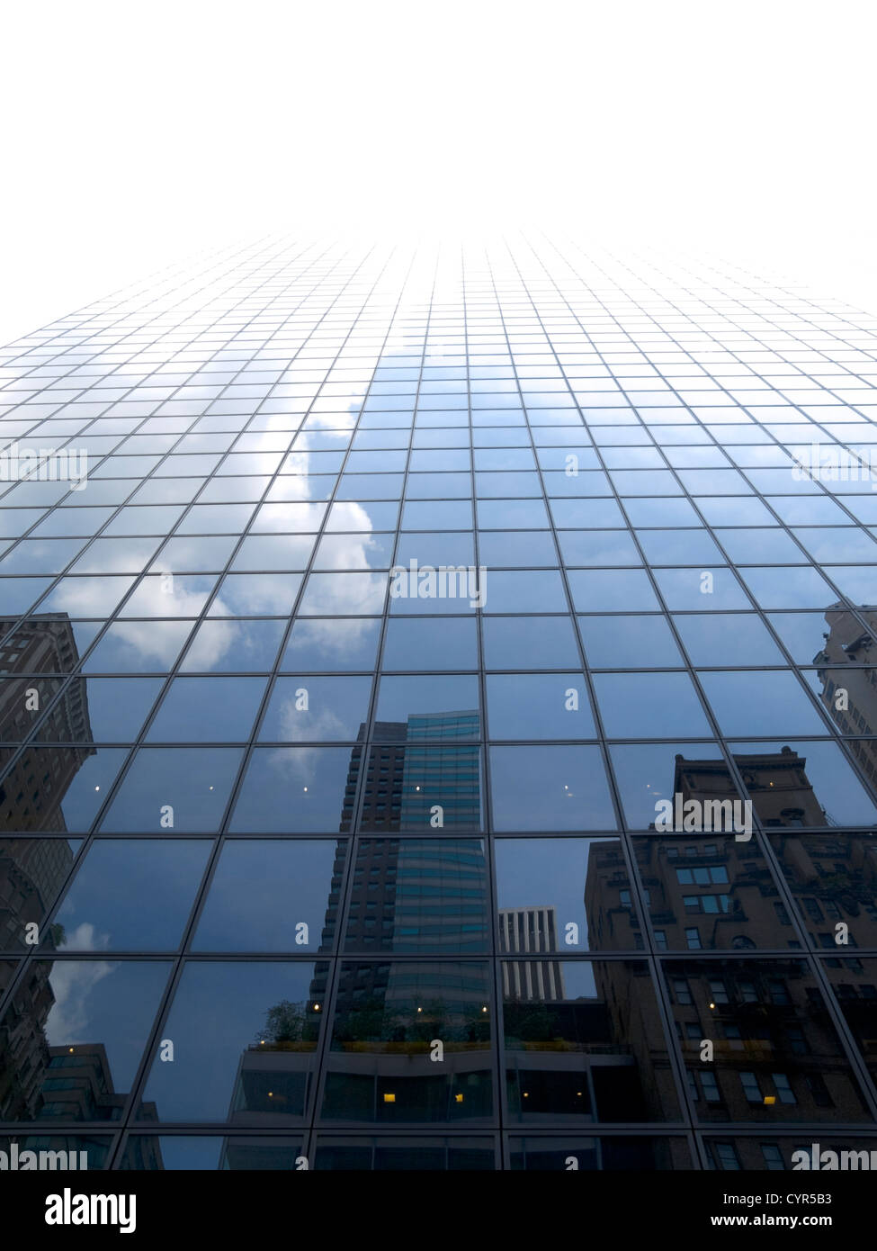 High modern skyscraper on a background of a bright sky Stock Photo - Alamy