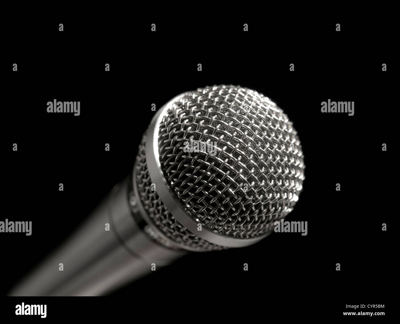 A dynamic microphone over a black background Stock Photo - Alamy