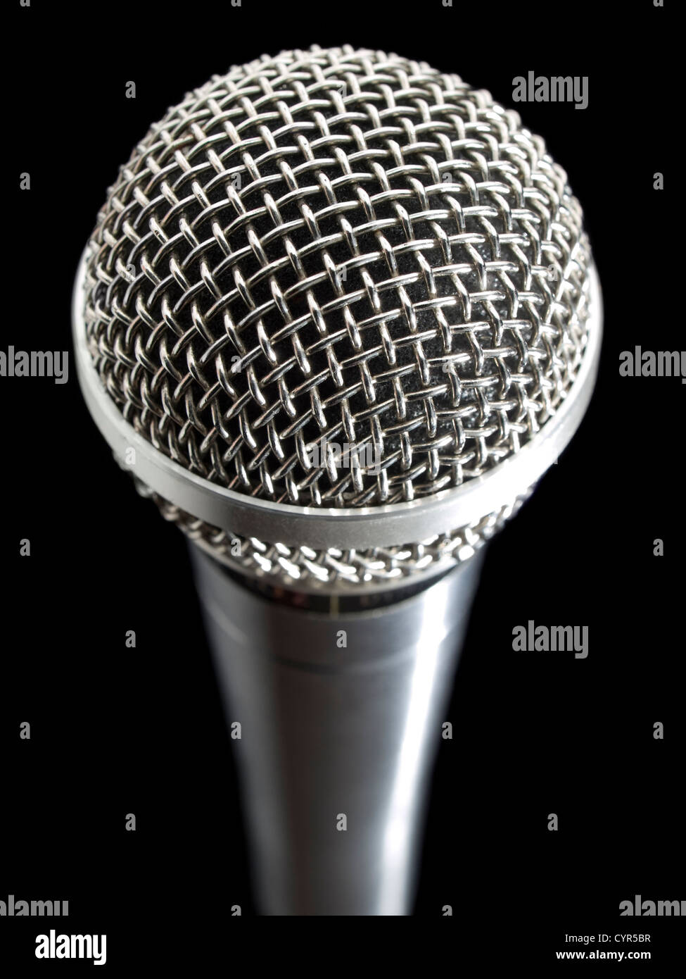 A dynamic microphone over a black background Stock Photo - Alamy