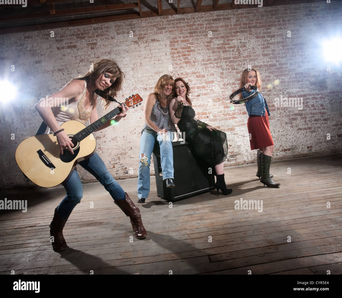 All girl band practicing before a big performance Stock Photo - Alamy