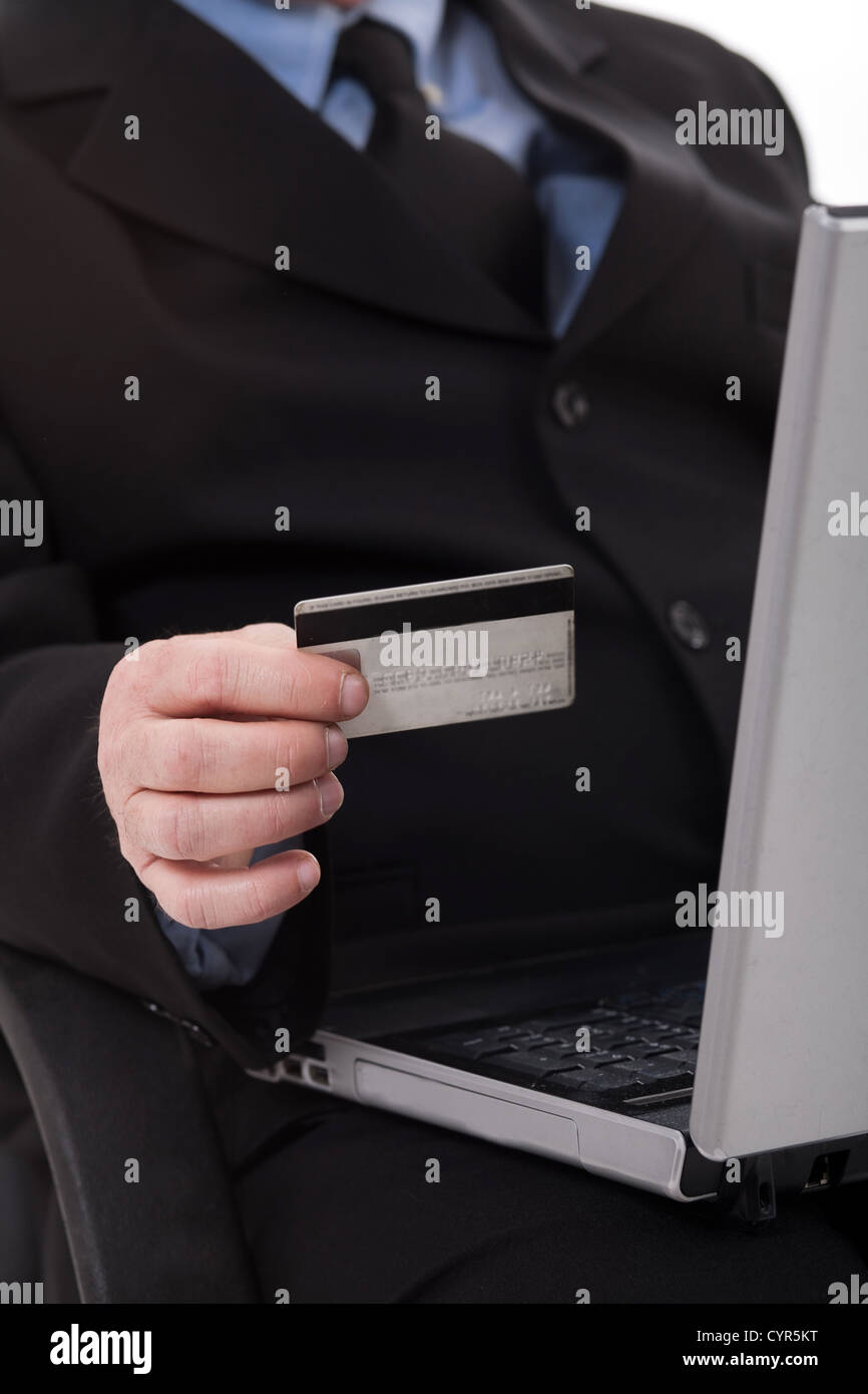 Business man with credit card focus on card over isolated background ...