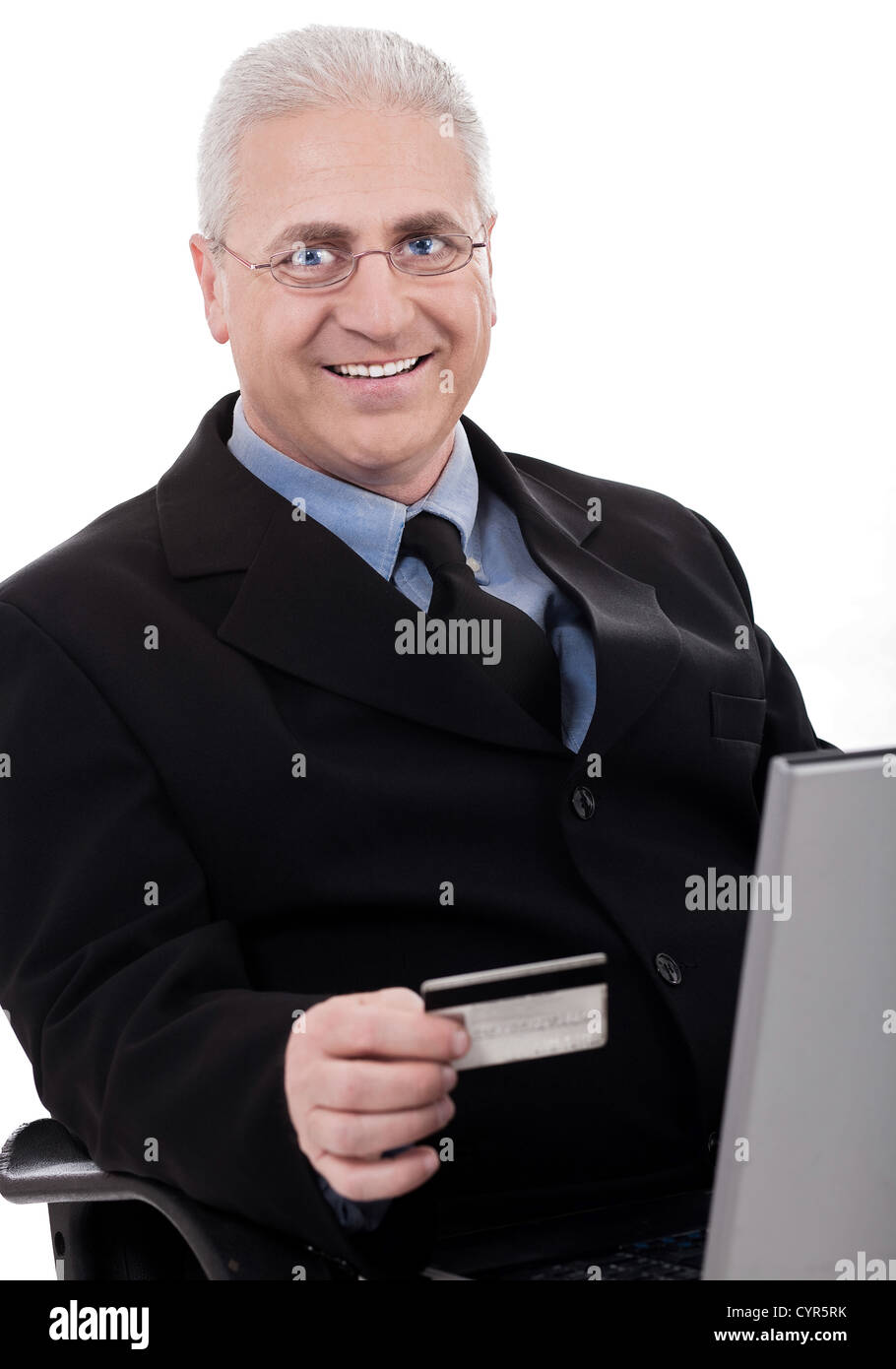 Senior business man making online purchase with his credit card on ...