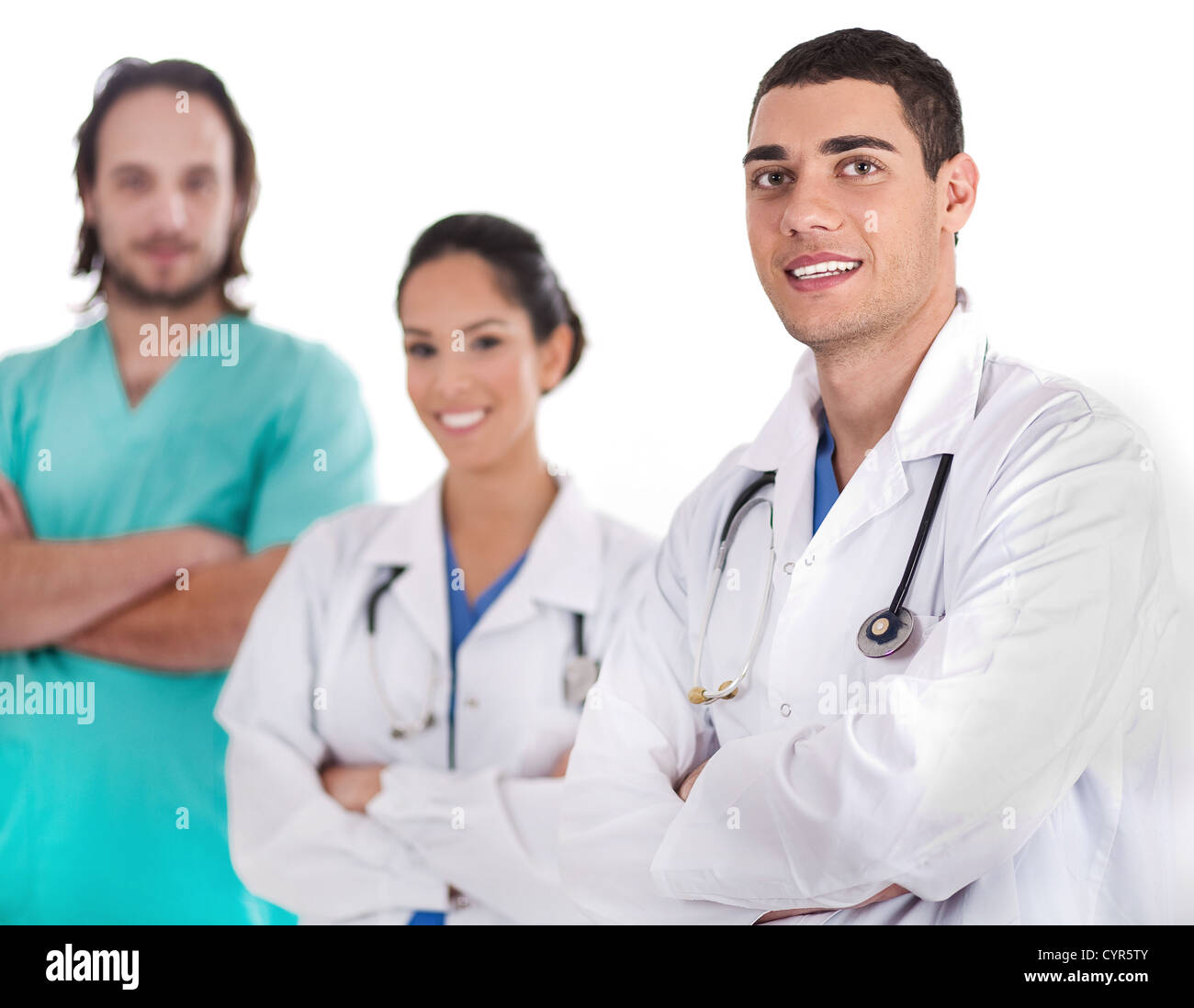 Group of doctors smiling at the camera over white background Stock ...