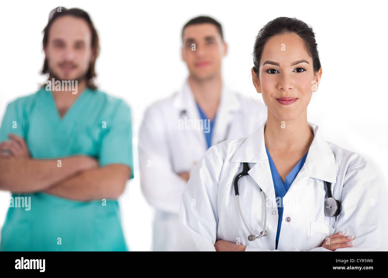 Medical team of Doctors and male nurse, women on front Stock Photo - Alamy
