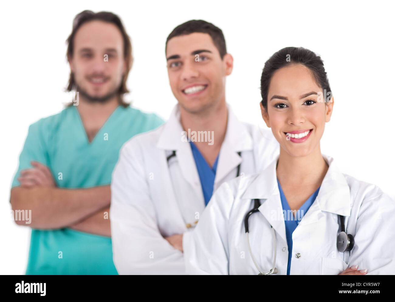 Portrait of three doctors in a hospital on isolated white background ...
