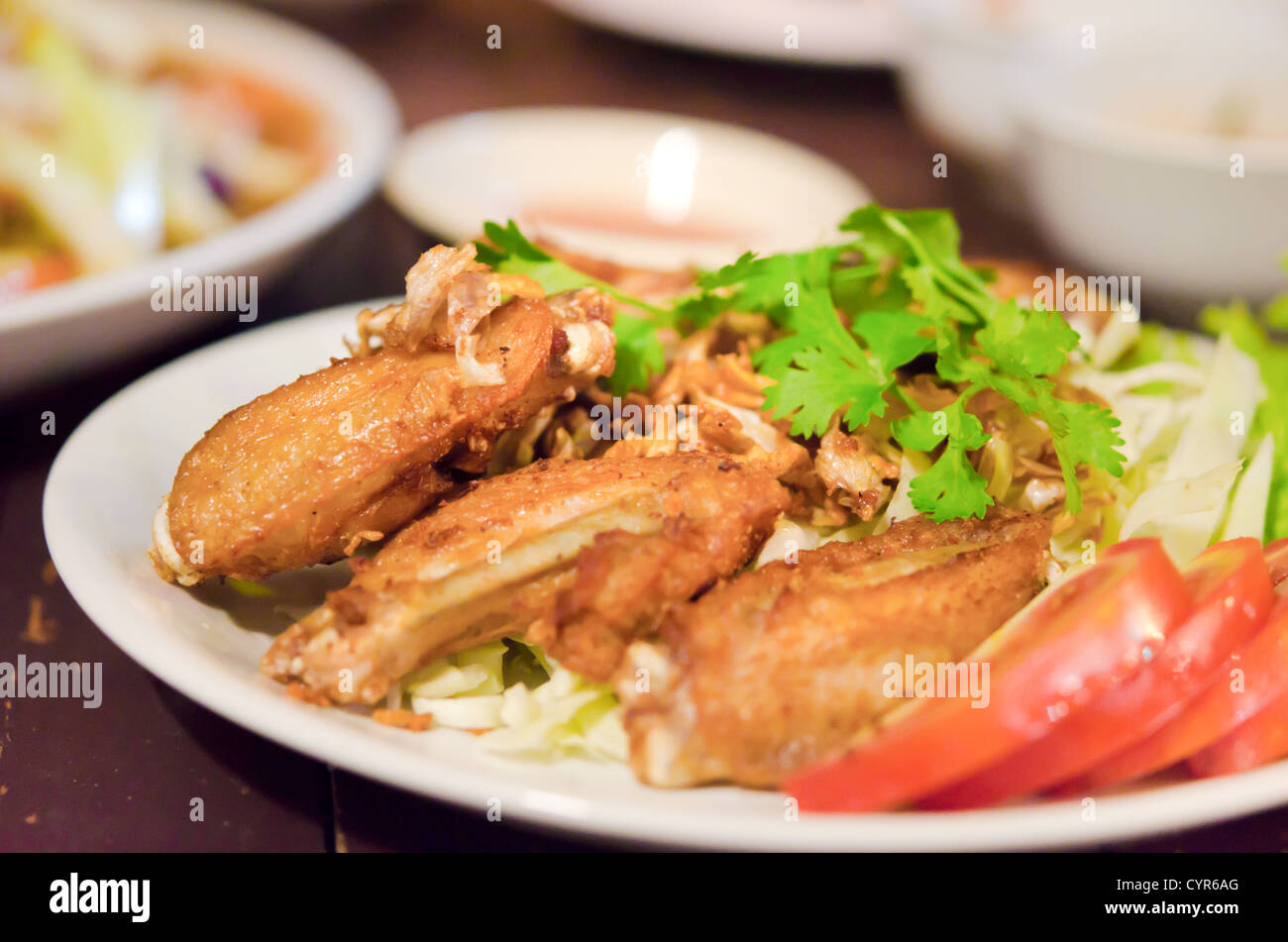 deep fried chicken with fried garlic and fresh vegetable Stock Photo ...