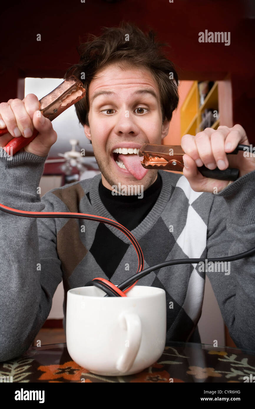 Man holding jumper cables hi-res stock photography and images - Alamy
