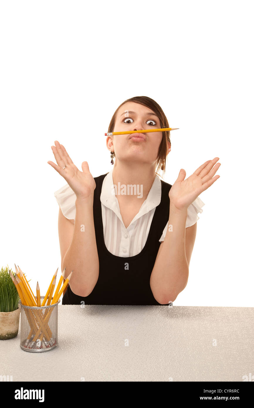 Bored female office worker at her desk Stock Photo - Alamy