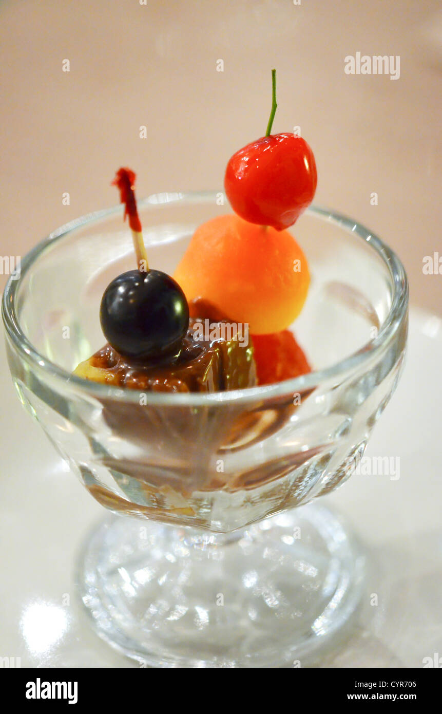 scoop of melon balls , cherry and fondo chocolate Stock Photo - Alamy